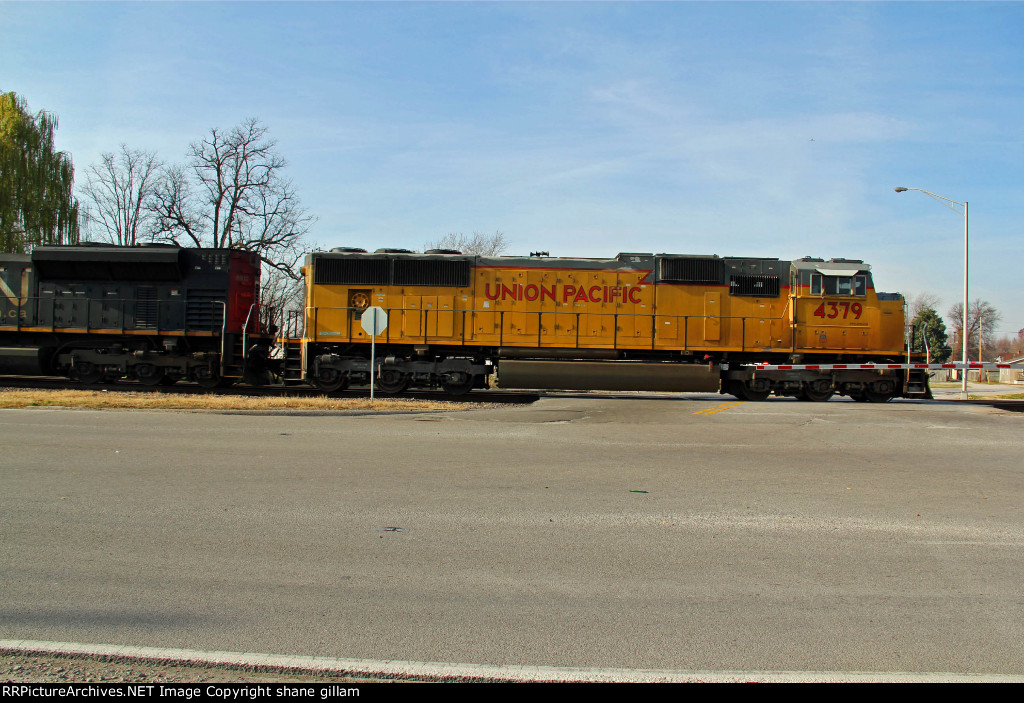 UP 4379 leads a stack train NB out of Dupo IL.